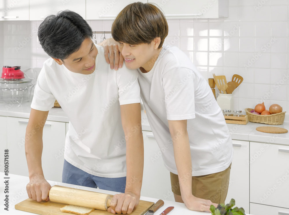 Young asian male LGBT couple happy looking eye contact together during ...
