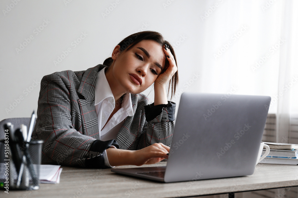 Portrait of a young businesswoman in a state of emotional, physical and ...