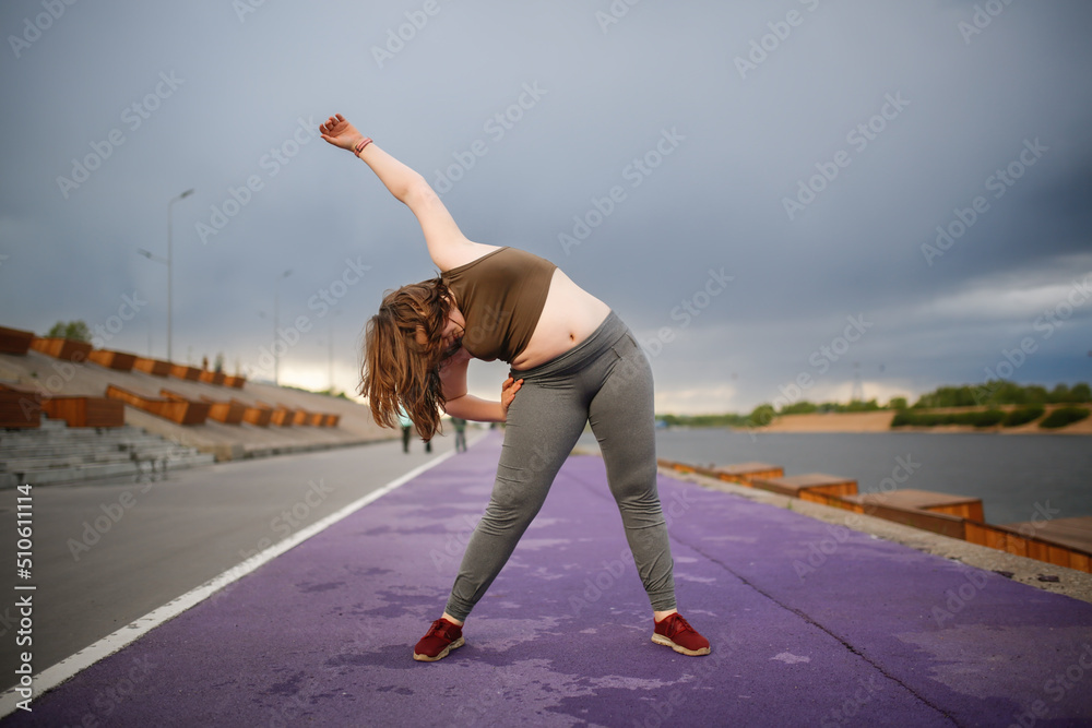 Obese fat kid girl training and exercise at park town on morning ...