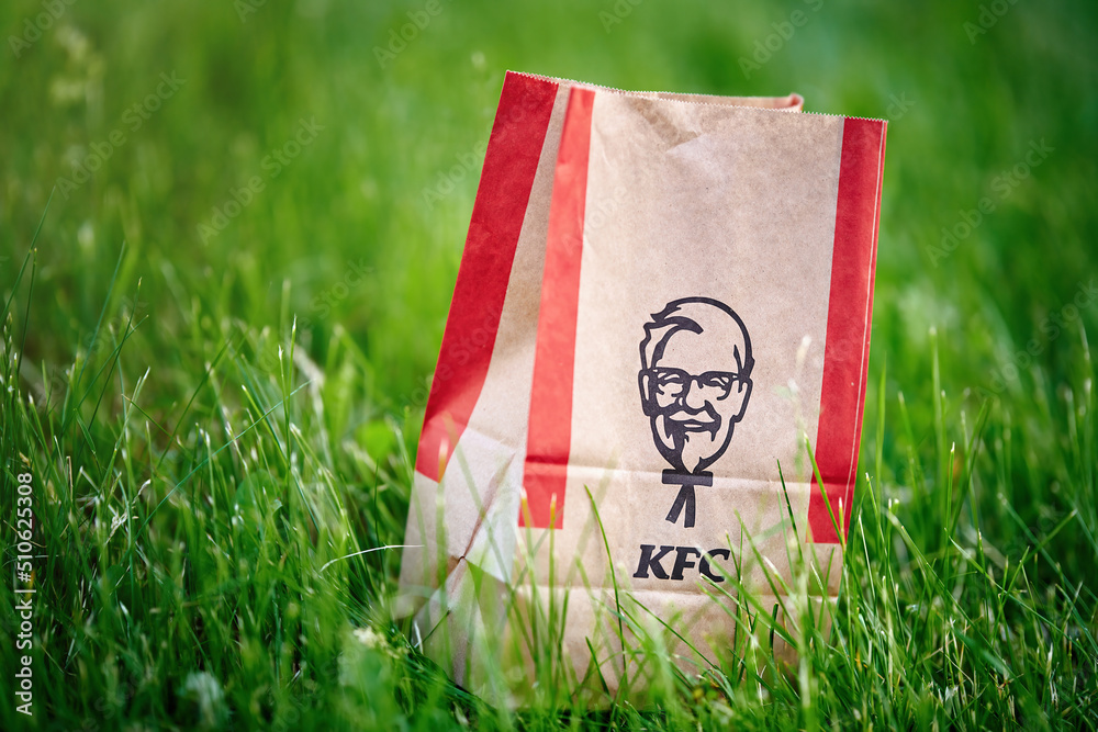Minsk, Belarus. Jun 2022. KFC Paper bag on green grass. Kentucky Fried ...