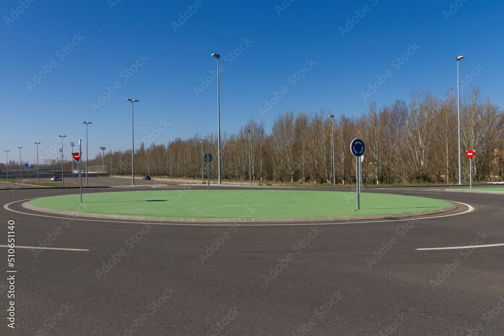 Roundabout of new construction, designed in cement painted green ...