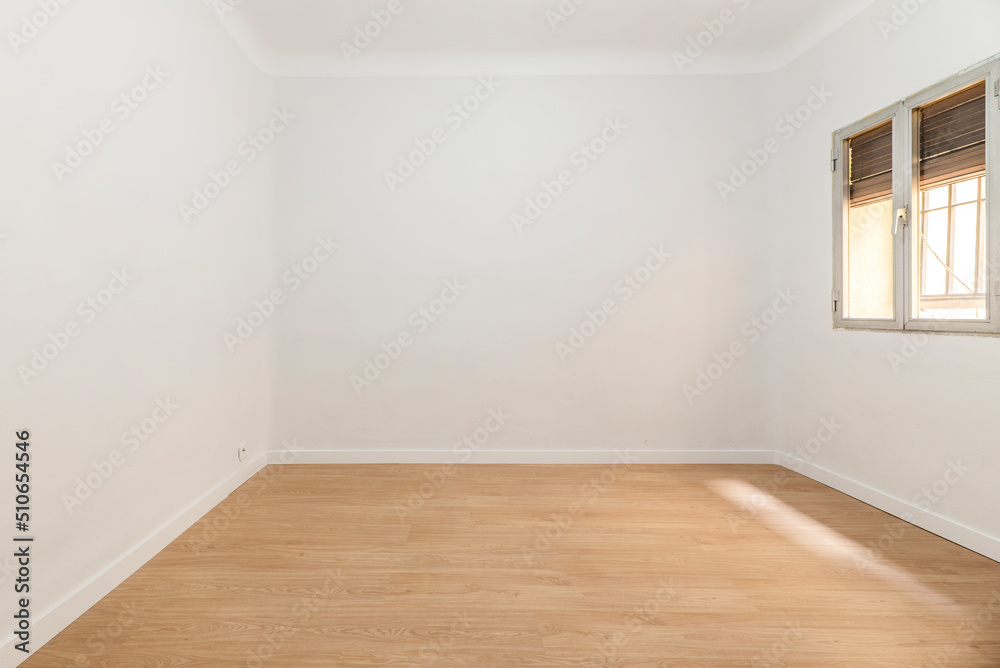 Empty room with aluminum window with shutter half up, wooden ...