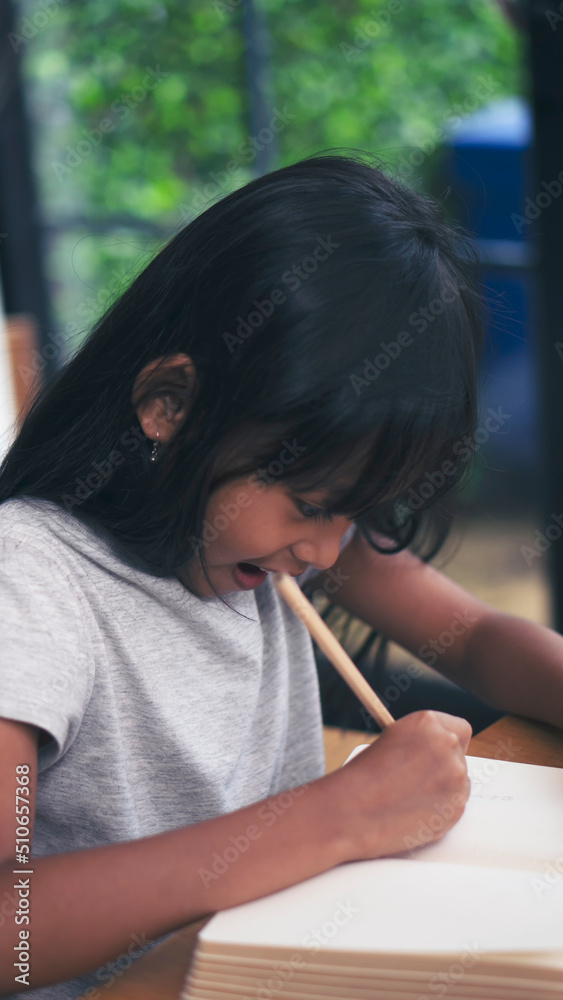 Asian elementary Children Writing Letter on diary book. Kid learn and ...
