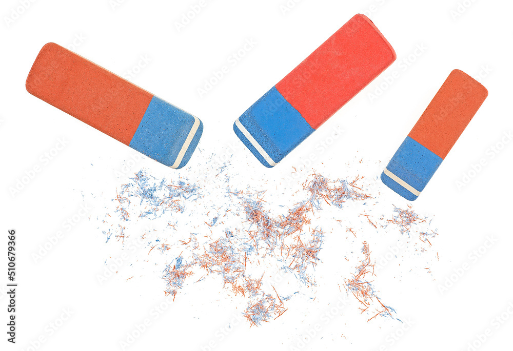 Red and blue erasers and eraser shavings isolated on a white background ...