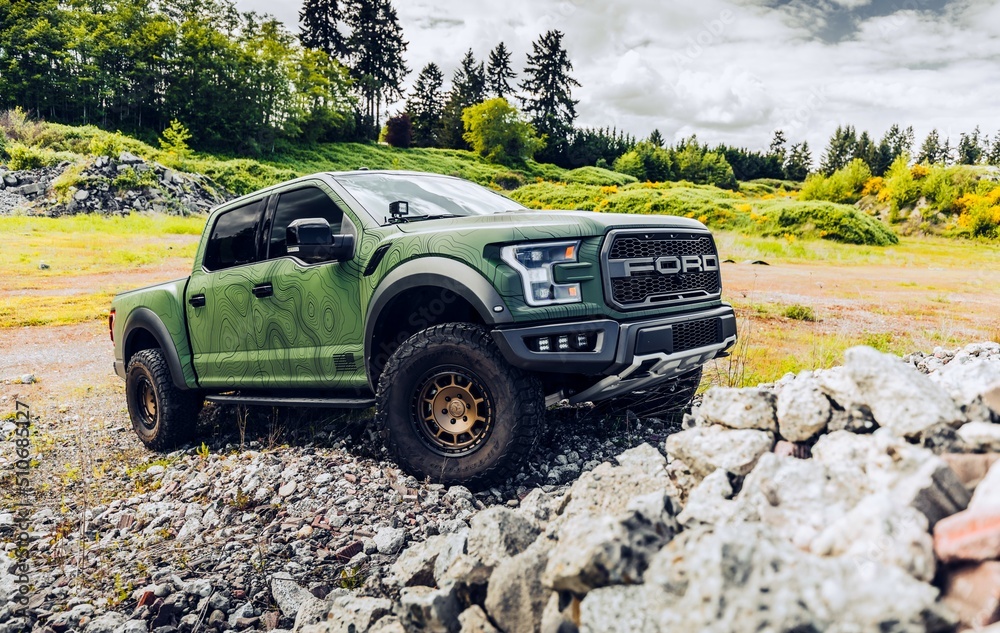 Seattle, WA, USA March 1, 2022 Green Ford Raptor with a vinyl wrap ...