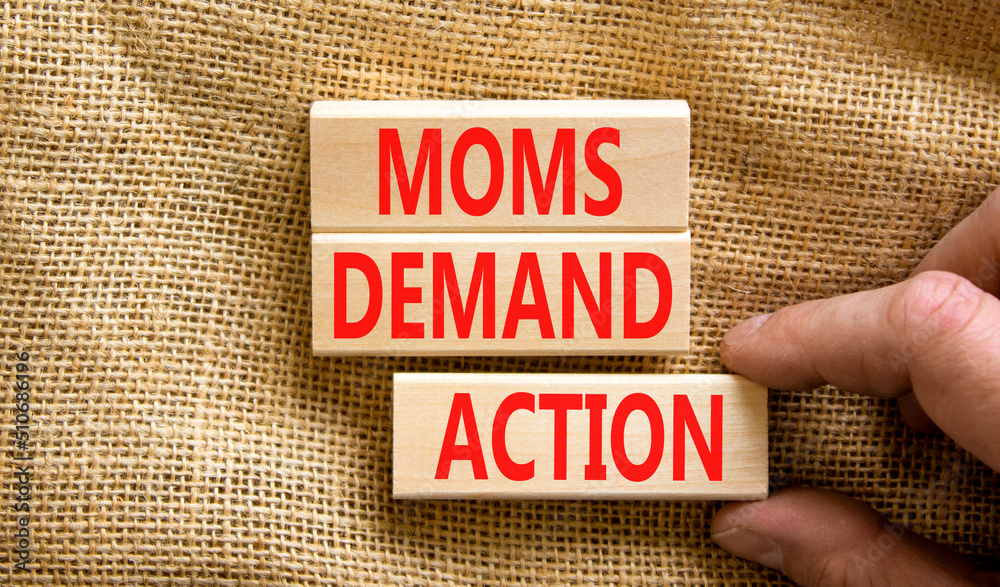 Moms demand action symbol. Concept words Moms demand action on wooden ...