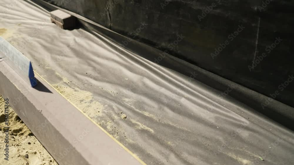 Preparation of the base for laying paving slabs. The process of ...