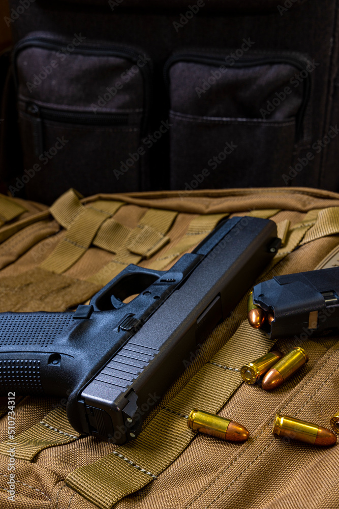 Artistic photo of a semi automatic 9mm handgun on a brown background in ...