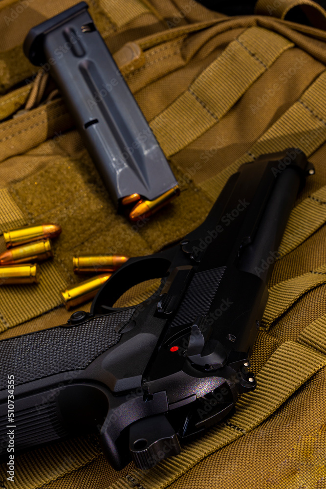 Artistic photo of a semi automatic 9mm handgun on a brown background in ...