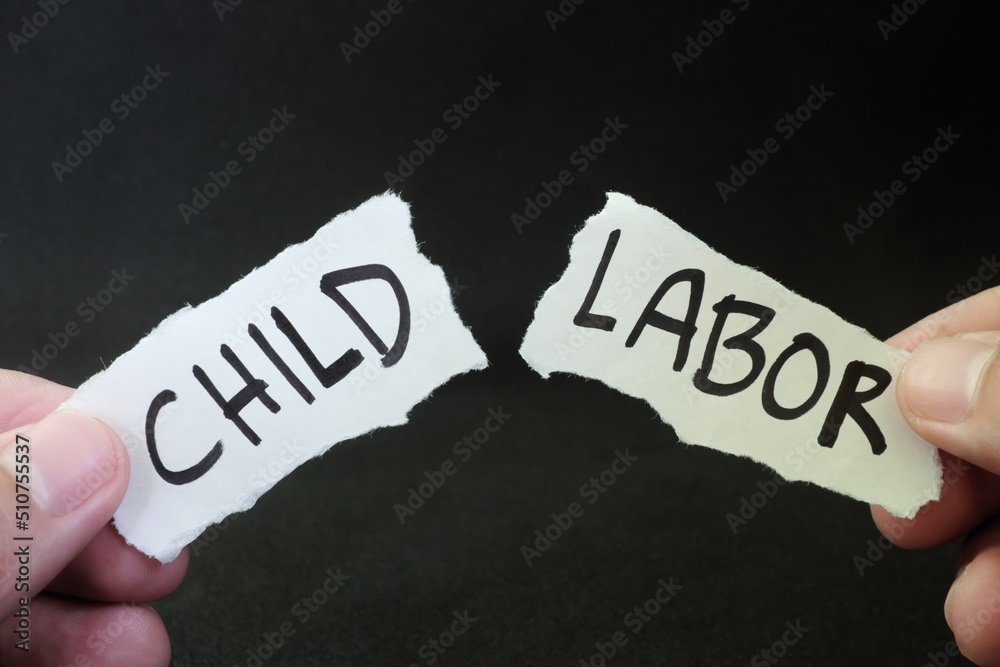 Stop and fight child labor concept. Human hand tearing a piece paper ...