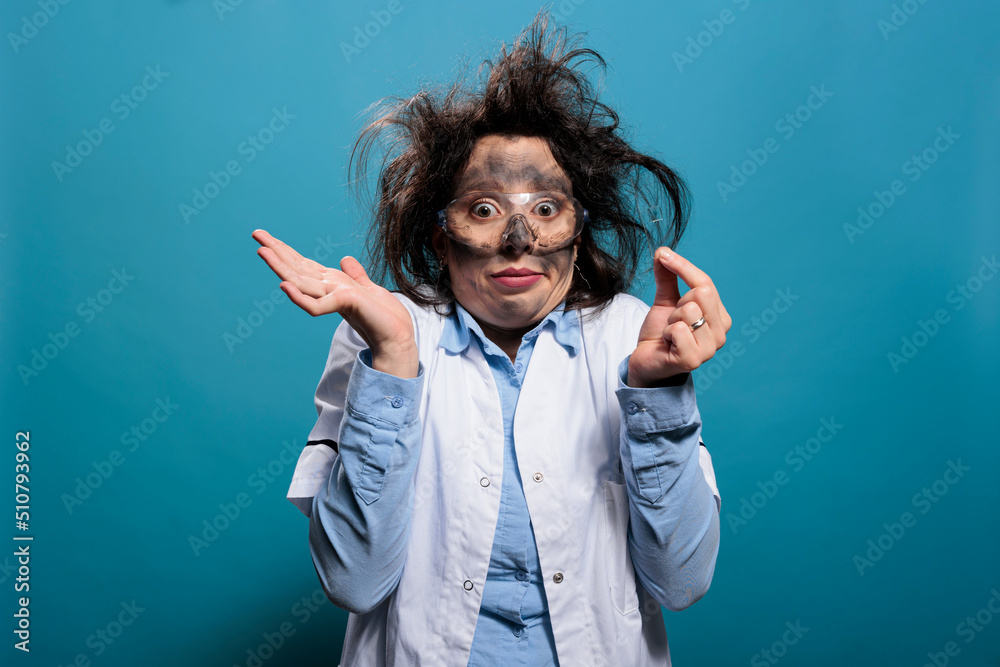 Silly and crazy biochemist looking at microscopic sample after chemical ...