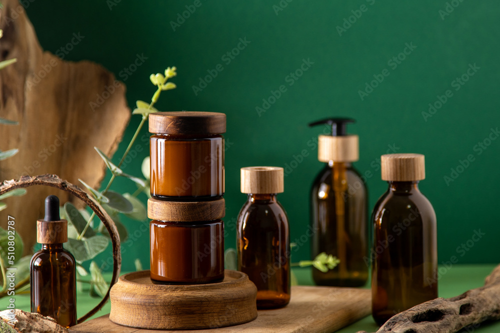 Glass brown containers for cosmetics with wooden lids. Cream jar ...