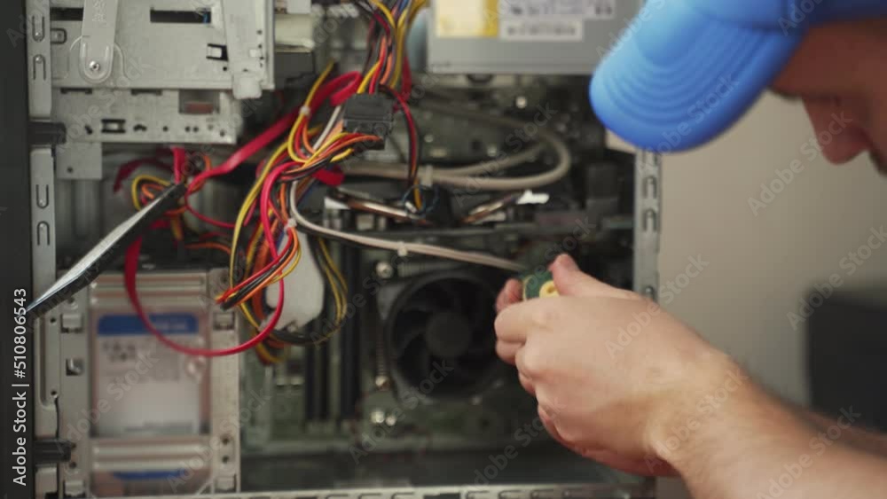 Man worker hands adjust cooling system in computer system unit. Repair ...