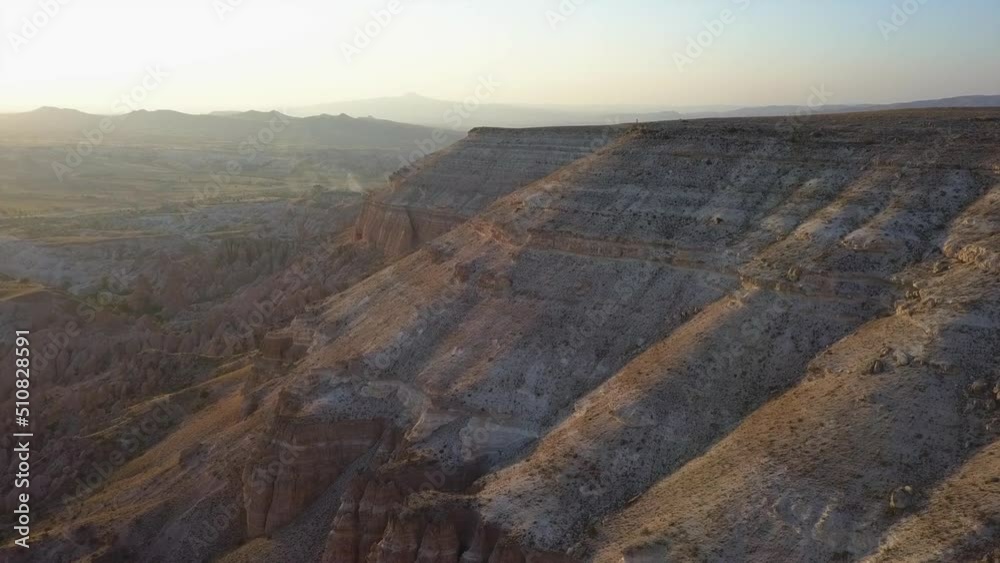 Geologic layers, eons of erosion seen in sunset aerial of Cappadocia ...