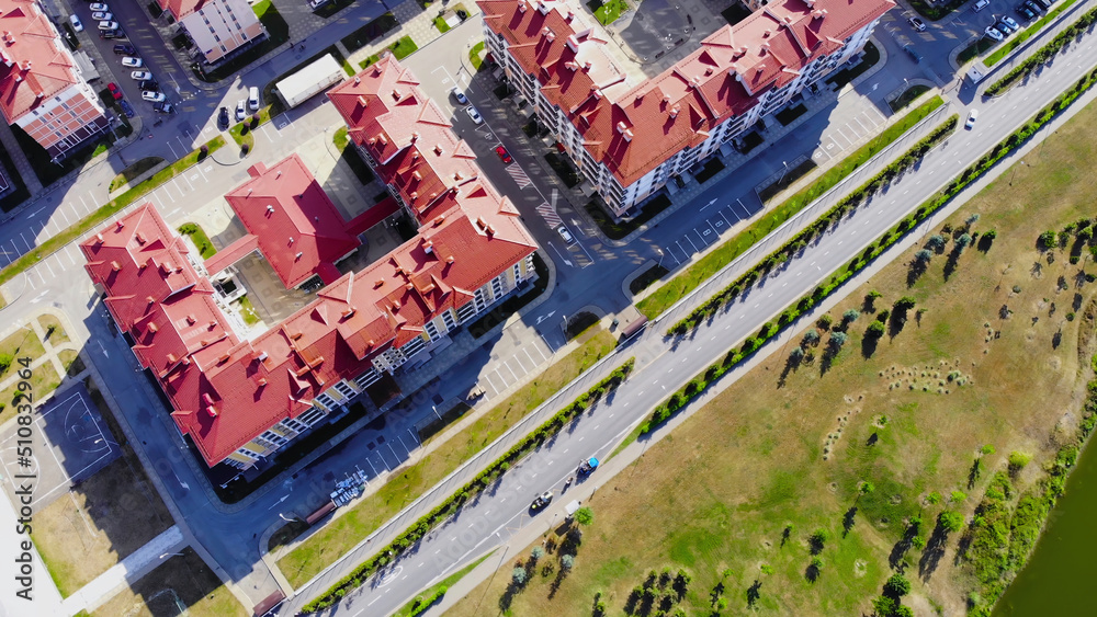 Top view of modern complex of houses with red roofs. Clip. Expensive ...