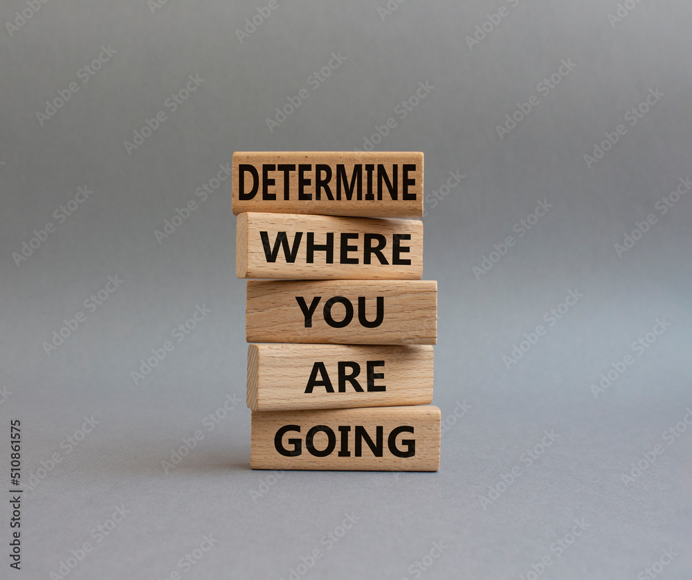 Determination symbol. Wooden blocks with words Determine where you are ...