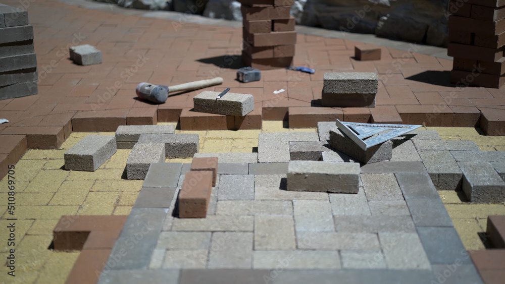 Construction zone detail of brick paver custom emblem in herringbone ...