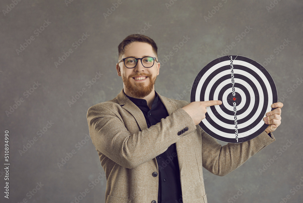 Studio portrait smiling confident young man in suit and hipster glasses ...