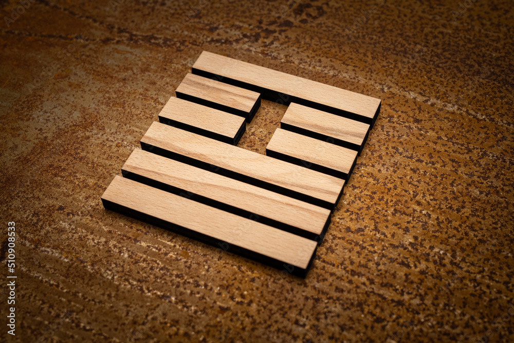 wooden Gene Key 26 i ging hexagram on rusty metal background human ...