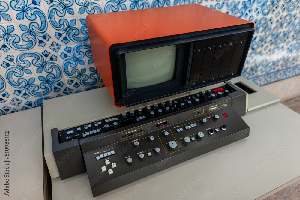 Retro technology computer with a monitor on the background azulejo ...