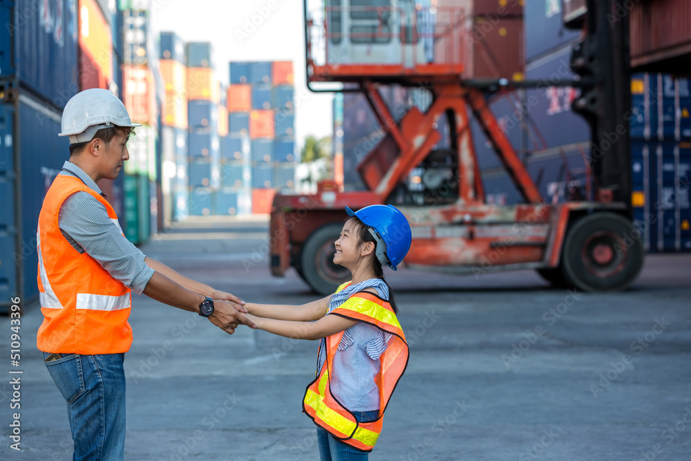 Father and little daughter wearing a safety helmet at Container cargo ...
