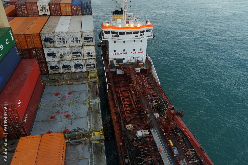 Aerial view on bunker barge with red hull and white superstructure ...