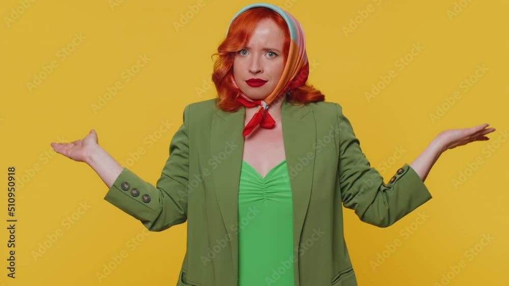 What Why. Sincere irritated redhead woman raising hands in indignant ...