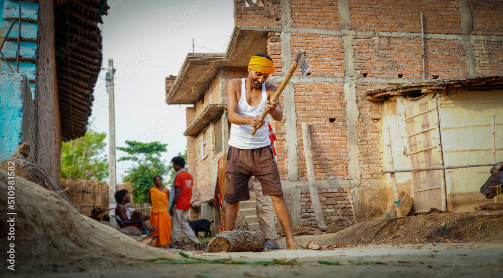 indian man splitting wood and cutting firewood with axe Stock Photo ...
