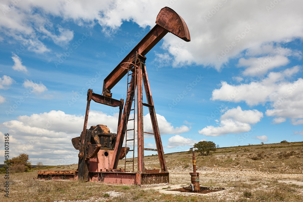 Oil pumping machine. Pump jack. Petroleum extraction. Global warming ...