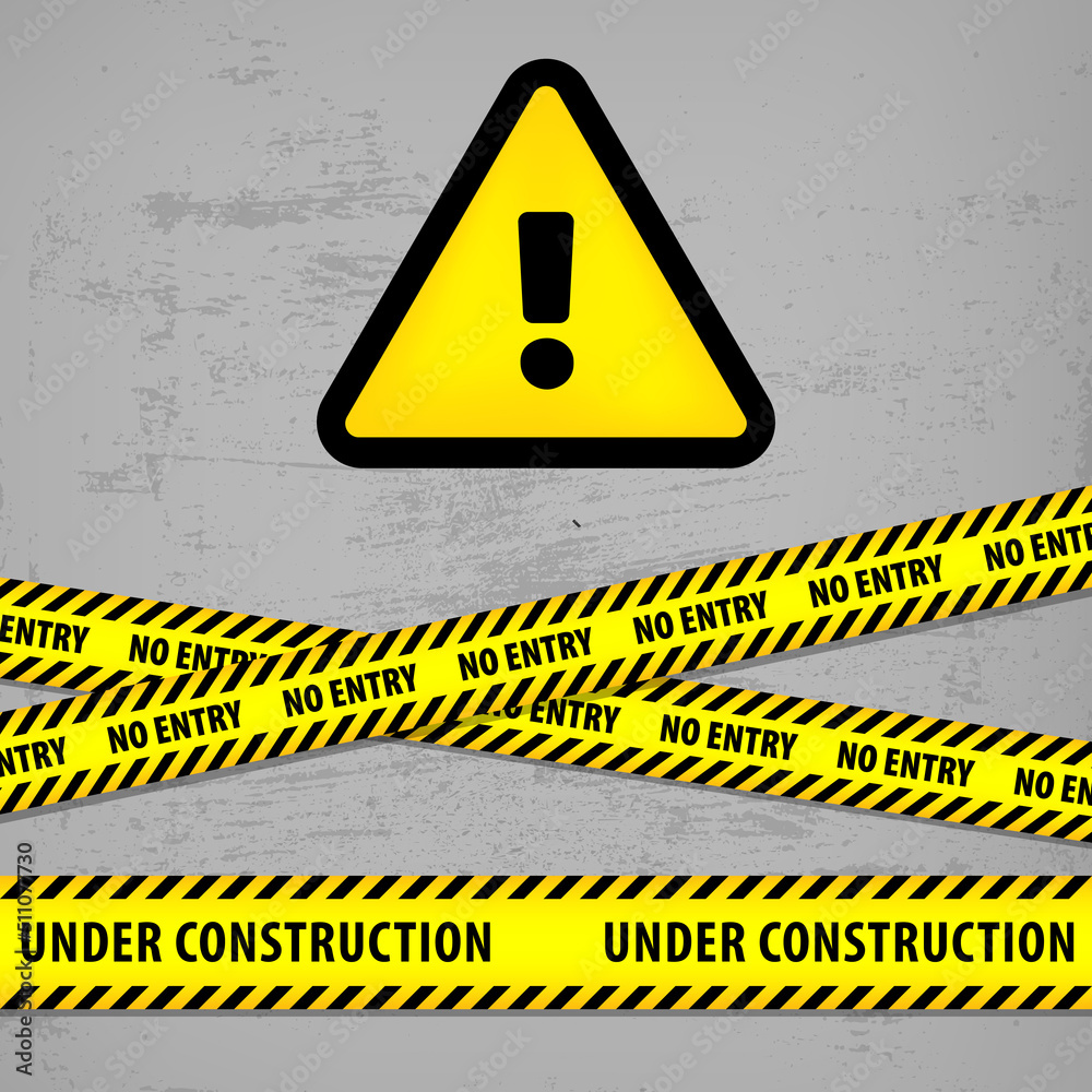 Under construction sign with exclamation mark on gray ground background ...