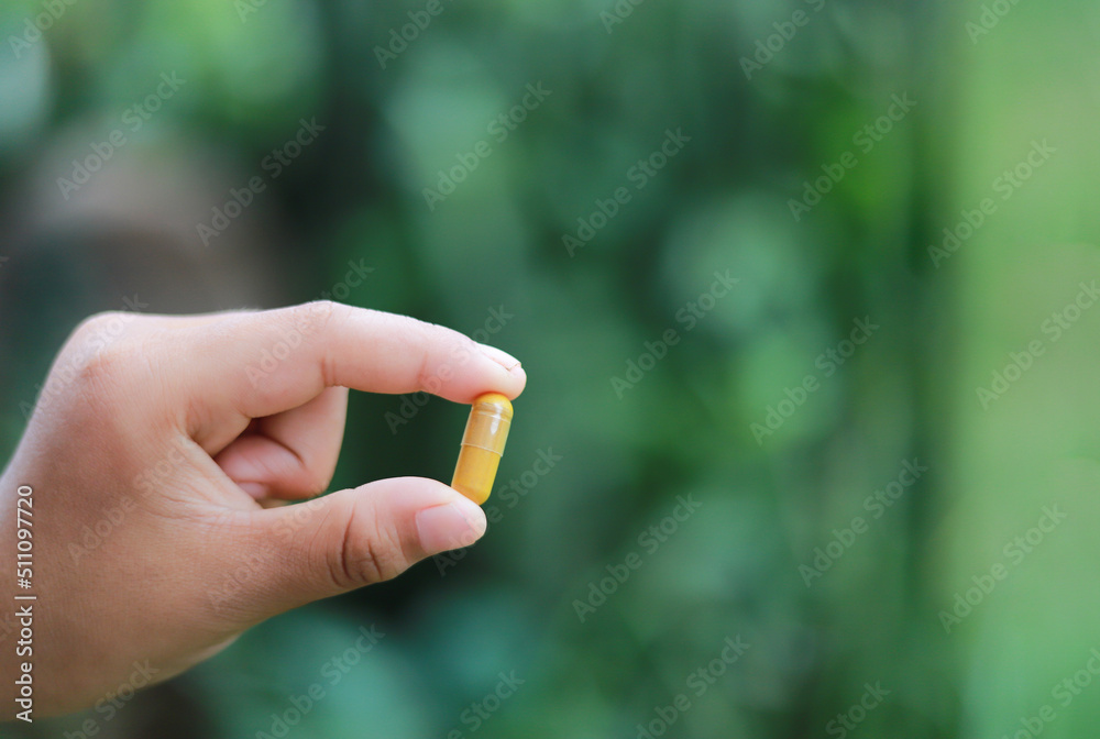 hand hold herbal medicine capsule for healthy eating in daily life ...