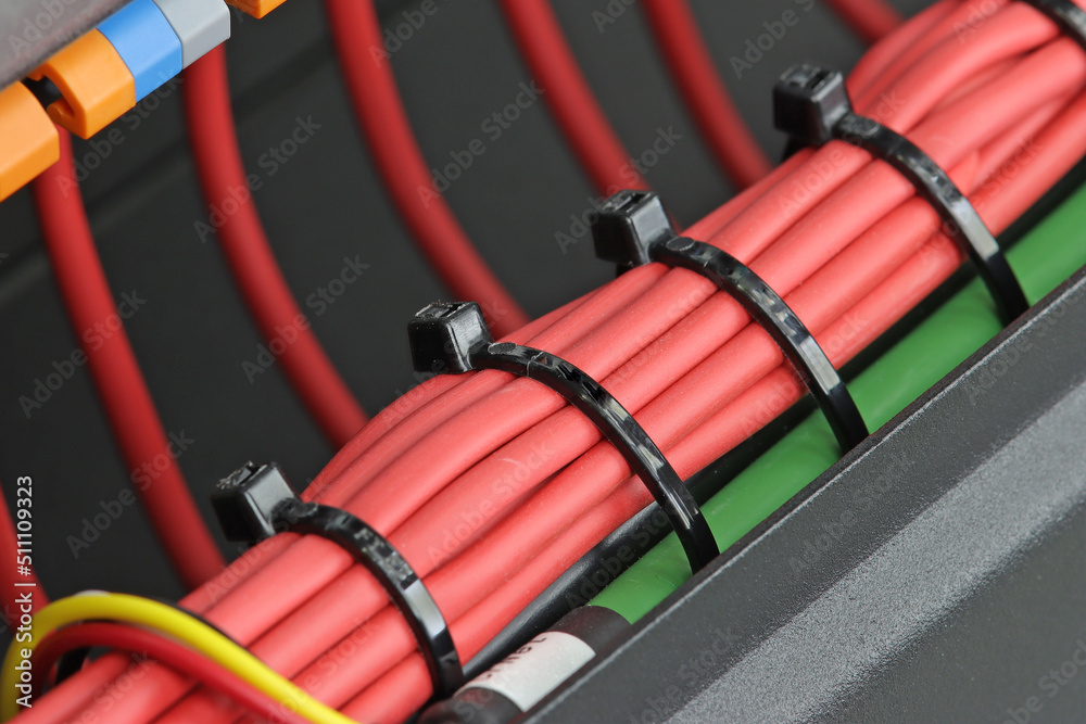 Insulated mounting wires tied with plastic ties in the electrical panel ...