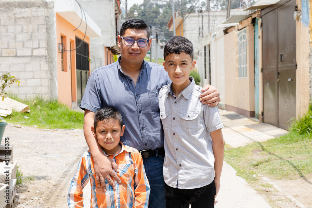 Latin dad with his children outside his house-Hispanic father proud of ...