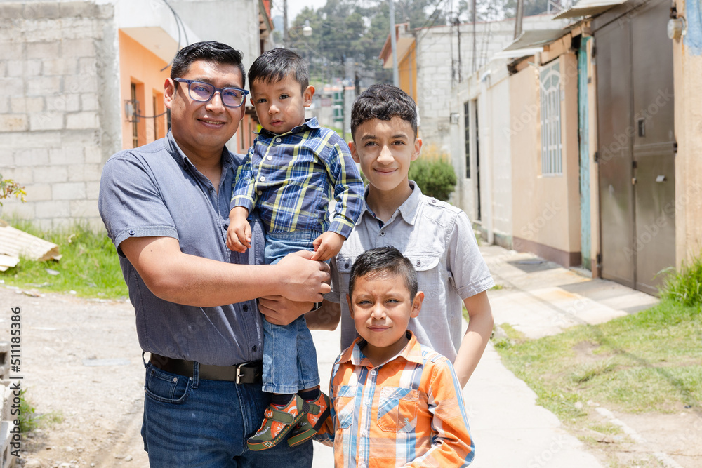 Latin dad with his children outside his house-Hispanic father proud of ...
