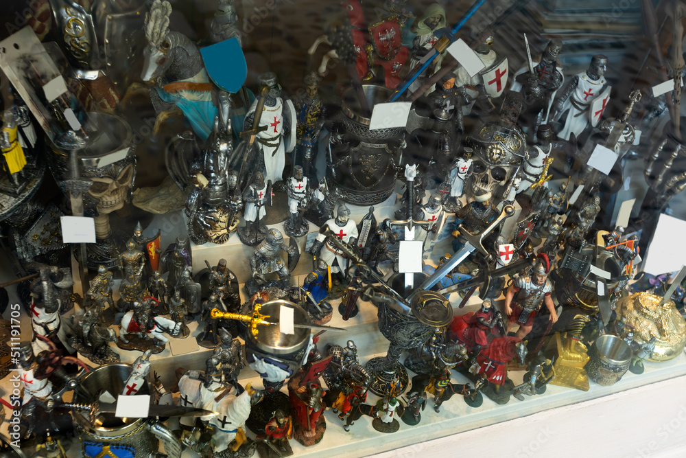 Collection of different figurines in showcase of souvenir shop of ...