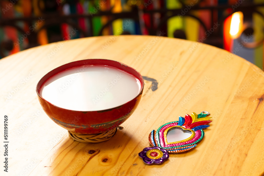 Authentic mexican drink pulque with decoration from oaxaca on a table ...