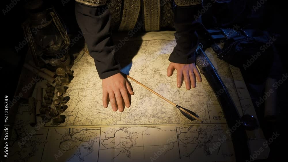 Commander and Map in Central Asia. The commander navigates the map with ...