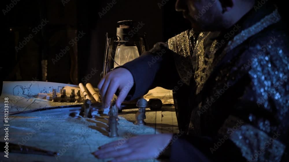 Working on a map with a sword in the historical period. Medieval ...