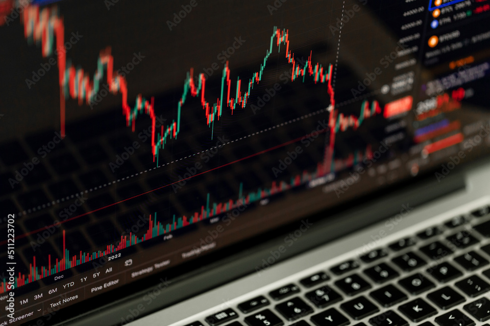 Trading chart displayed on the screen of the laptop. Stock market ...