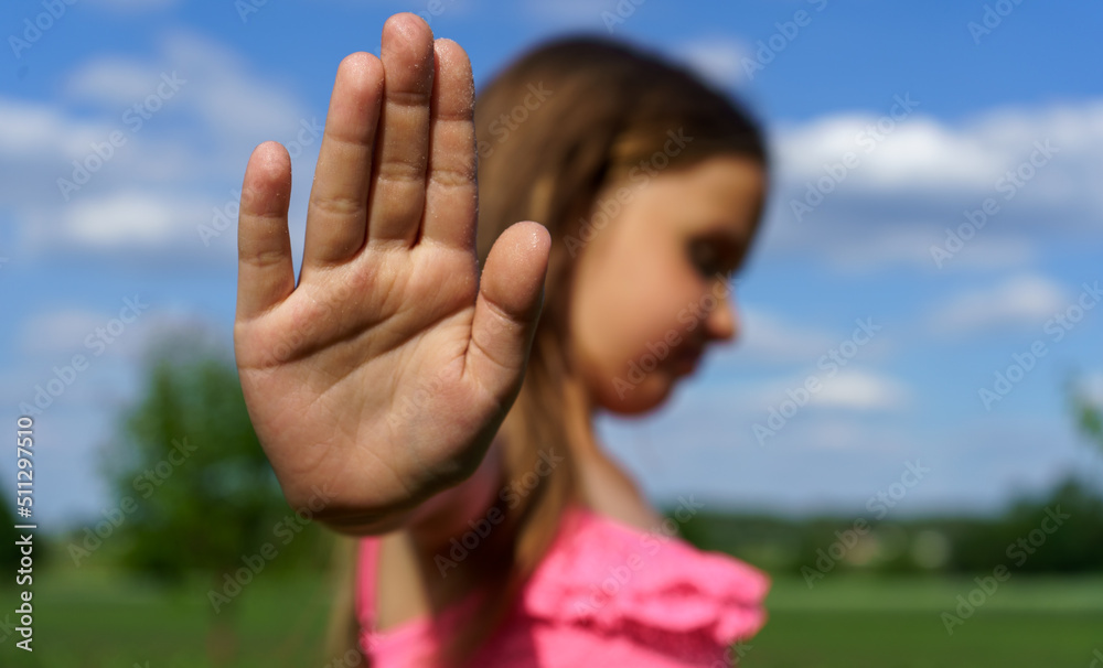 Little girl showing stop sign, child abuse issue, cruelty in family ...