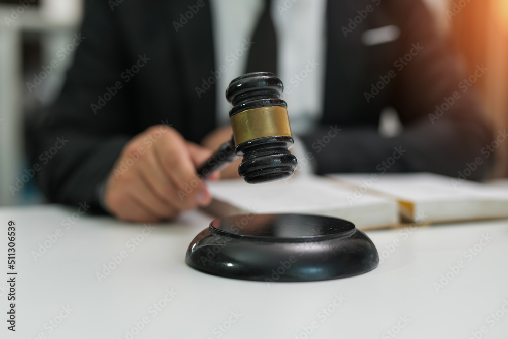 judge on wooden table And experienced lawyers meet with clients and ...