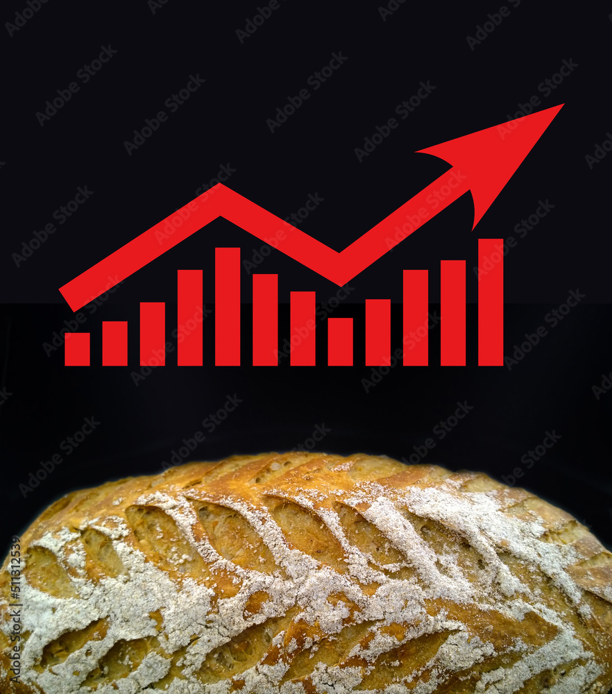 Red growing up arrow on dark background with bread. Bar charts and ...