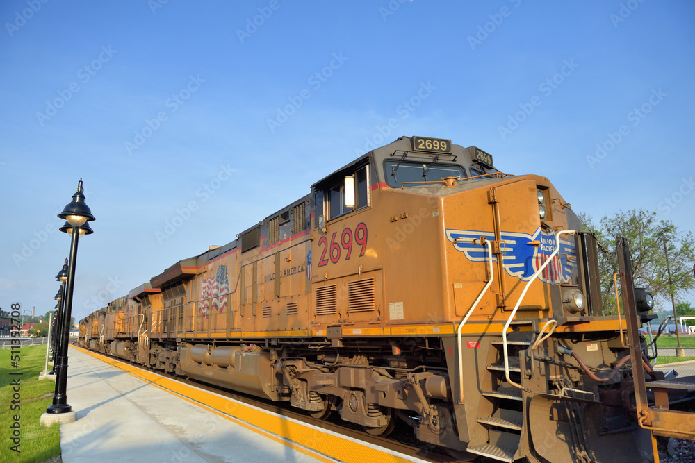 Union Pacific Railroad locomotives lead a freight train past a platform ...
