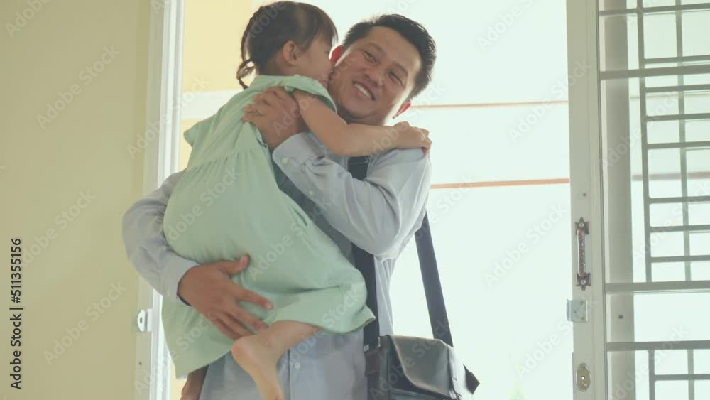 Happiness moment of happy Asian family when father returning home from ...