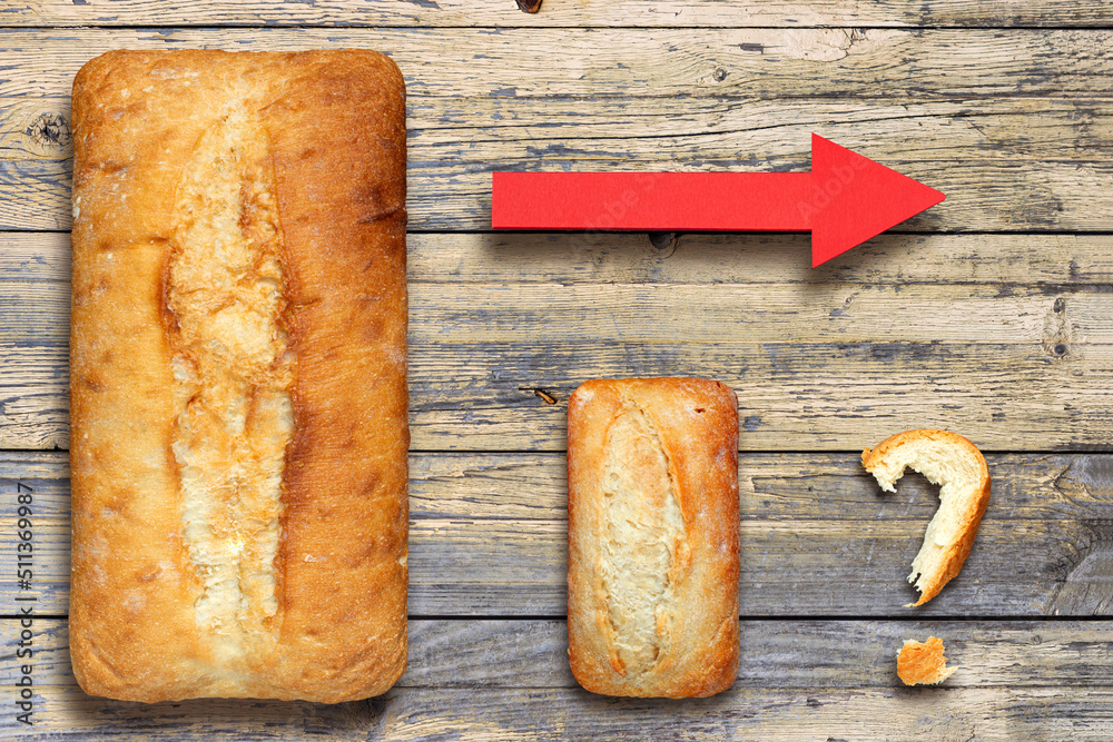 Loaves of bread with red arrow and question mark made of bread crusts ...