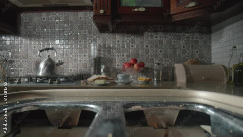 Sliced white bread popping out of a toaster on the kitchen table ...