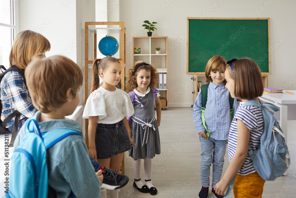 Group Of Kids Talking In Classroom
