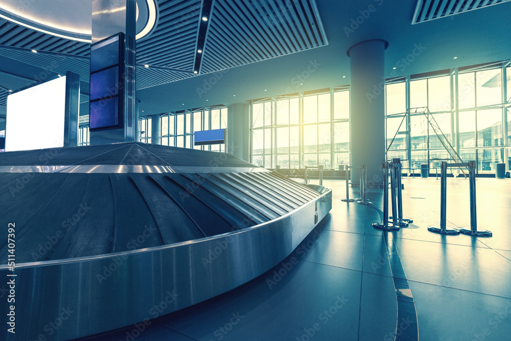 Baggage carousel at arrival airport hall Stock Photo | Adobe Stock