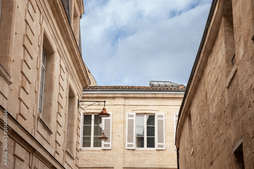 Facade of a typical old French residential building in Bordeaux, France ...