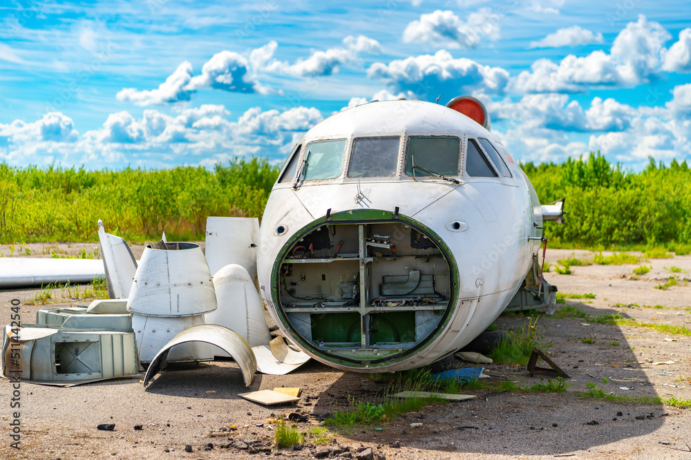 Old destroyed dismantled and abandoned Soviet aircraft in the field ...